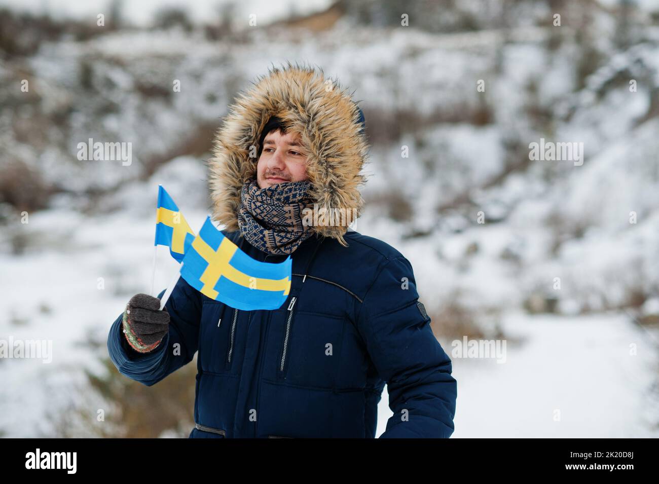 Scandinavian man with Sweden flag in winter swedish landscape Stock ...