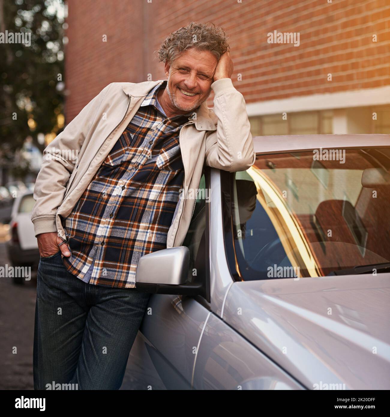 Time to kickoff my retirement with a road trip. Portrait of a happy ...