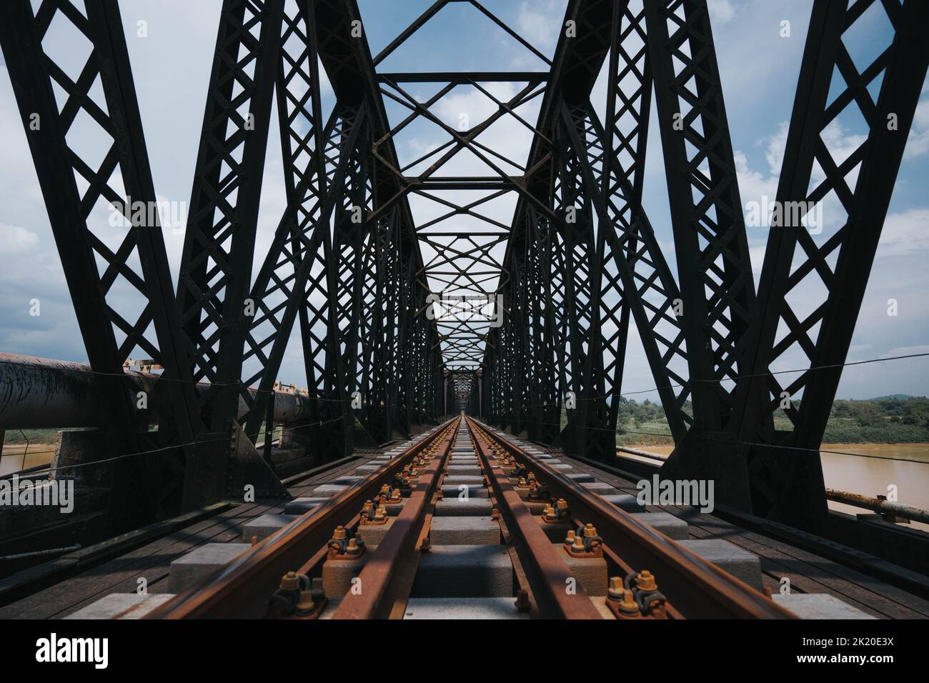 A tall steel bridge with a railway over the river Stock Photo - Alamy