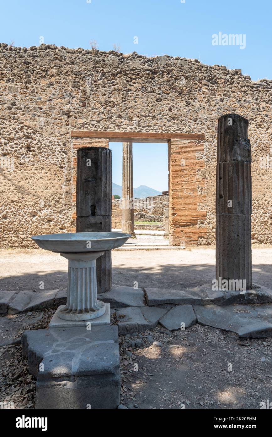 Marble pillars and fountain inside ancient roman house in Pompei Stock ...