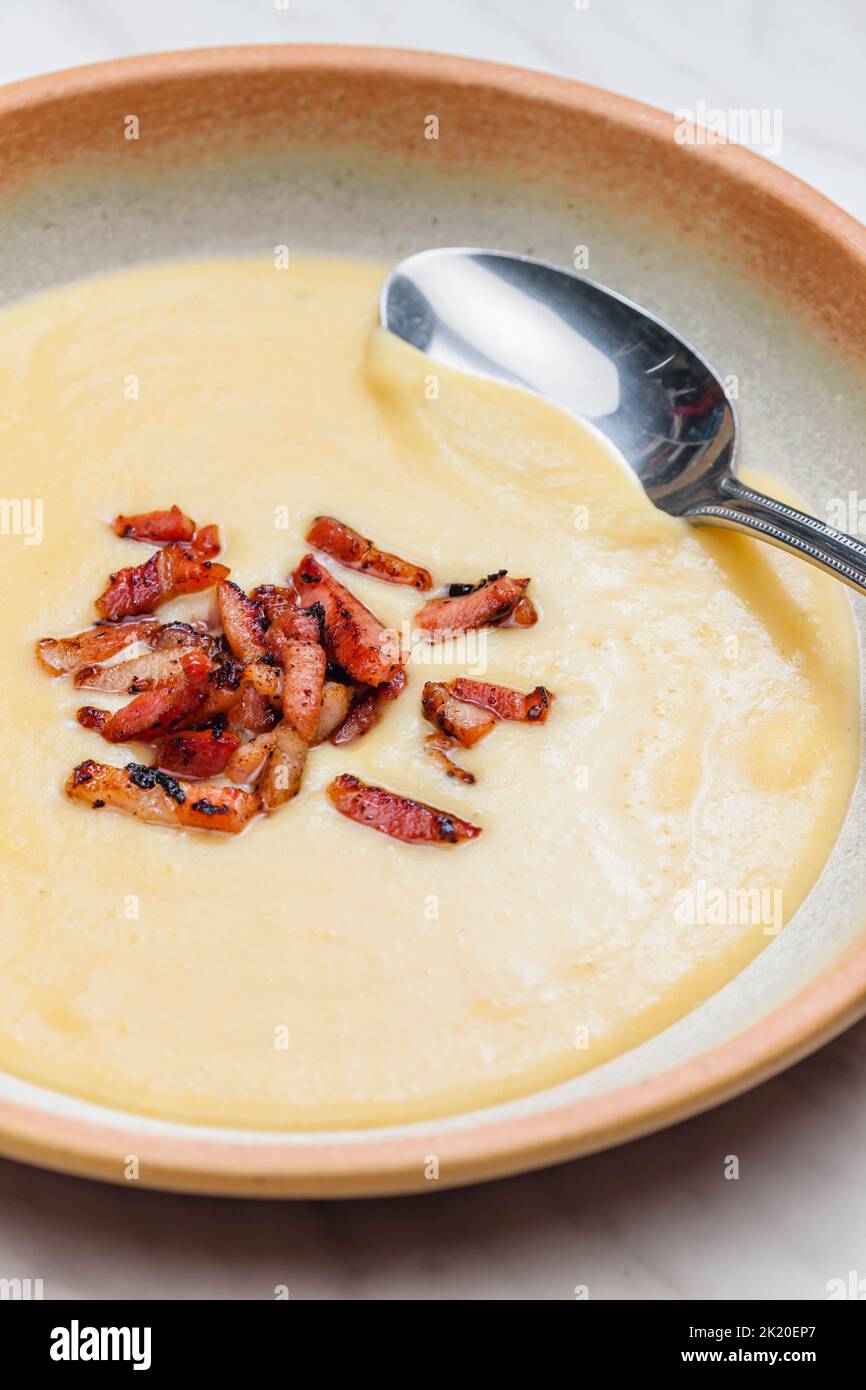 yellow peas porridge with bacon strips Stock Photo - Alamy