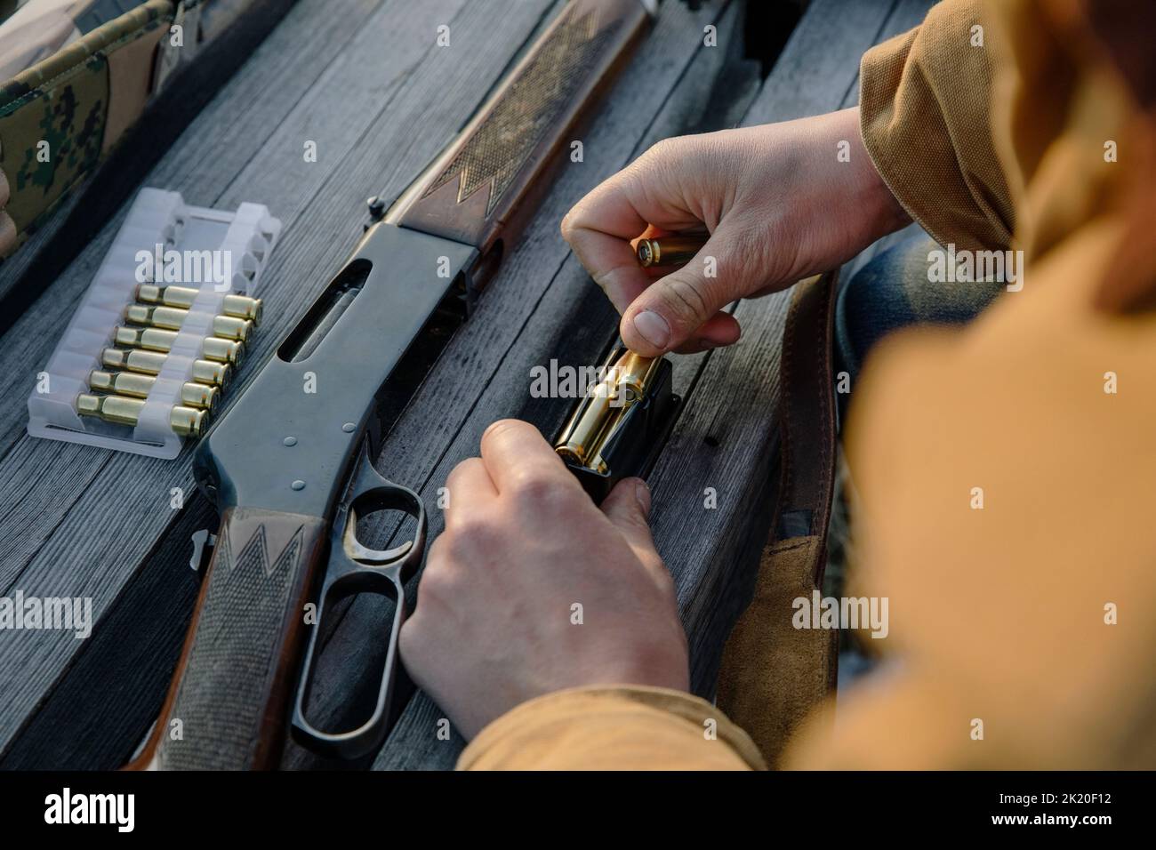 Holding gun on shoulder hi-res stock photography and images - Alamy