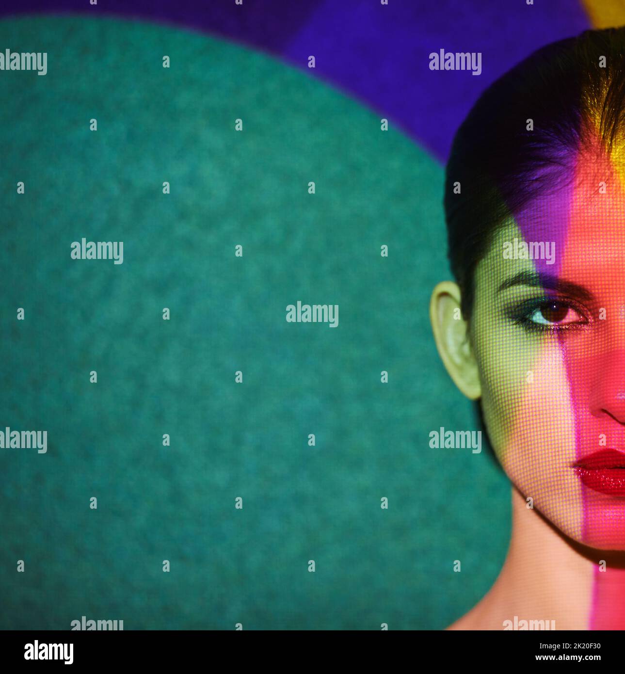 She adds color to simple beauty. A beautiful model in the studio ...