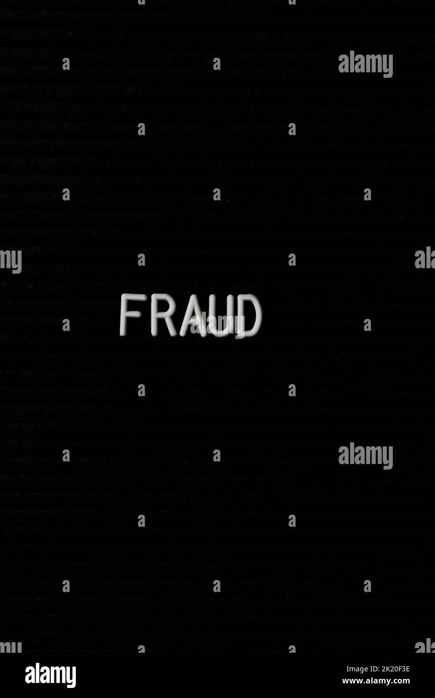 A vertical black spongy board with a text "fraud" for background Stock ...