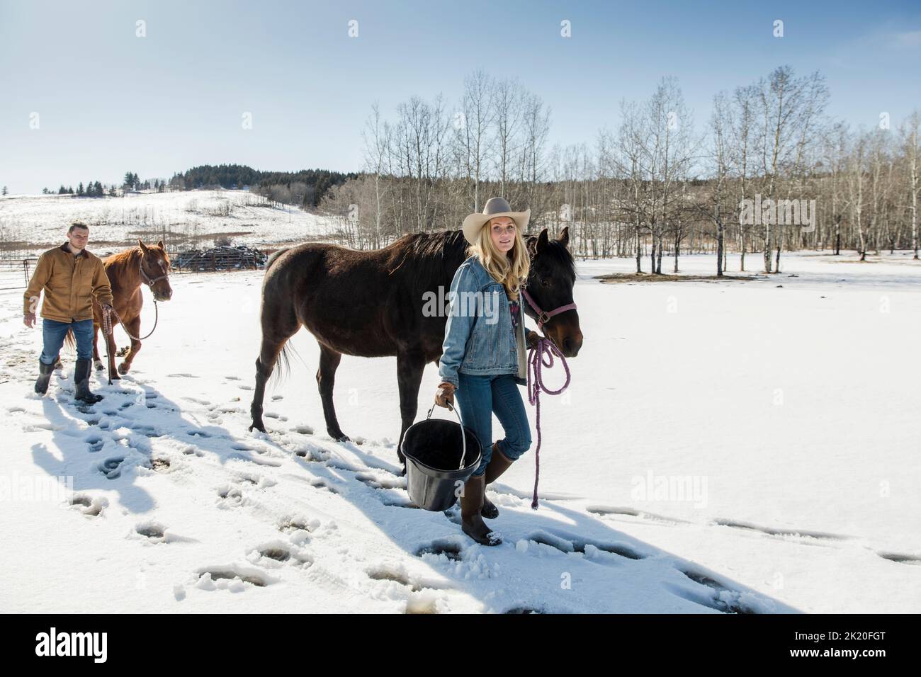 Female rancher walking horse in hi-res stock photography and images - Alamy