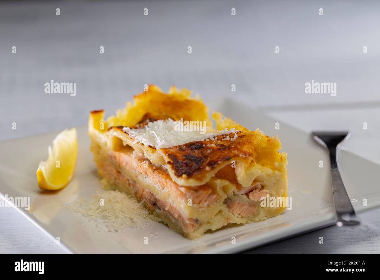 lasagne with salmon, bechamel and parmesan cheese Stock Photo - Alamy