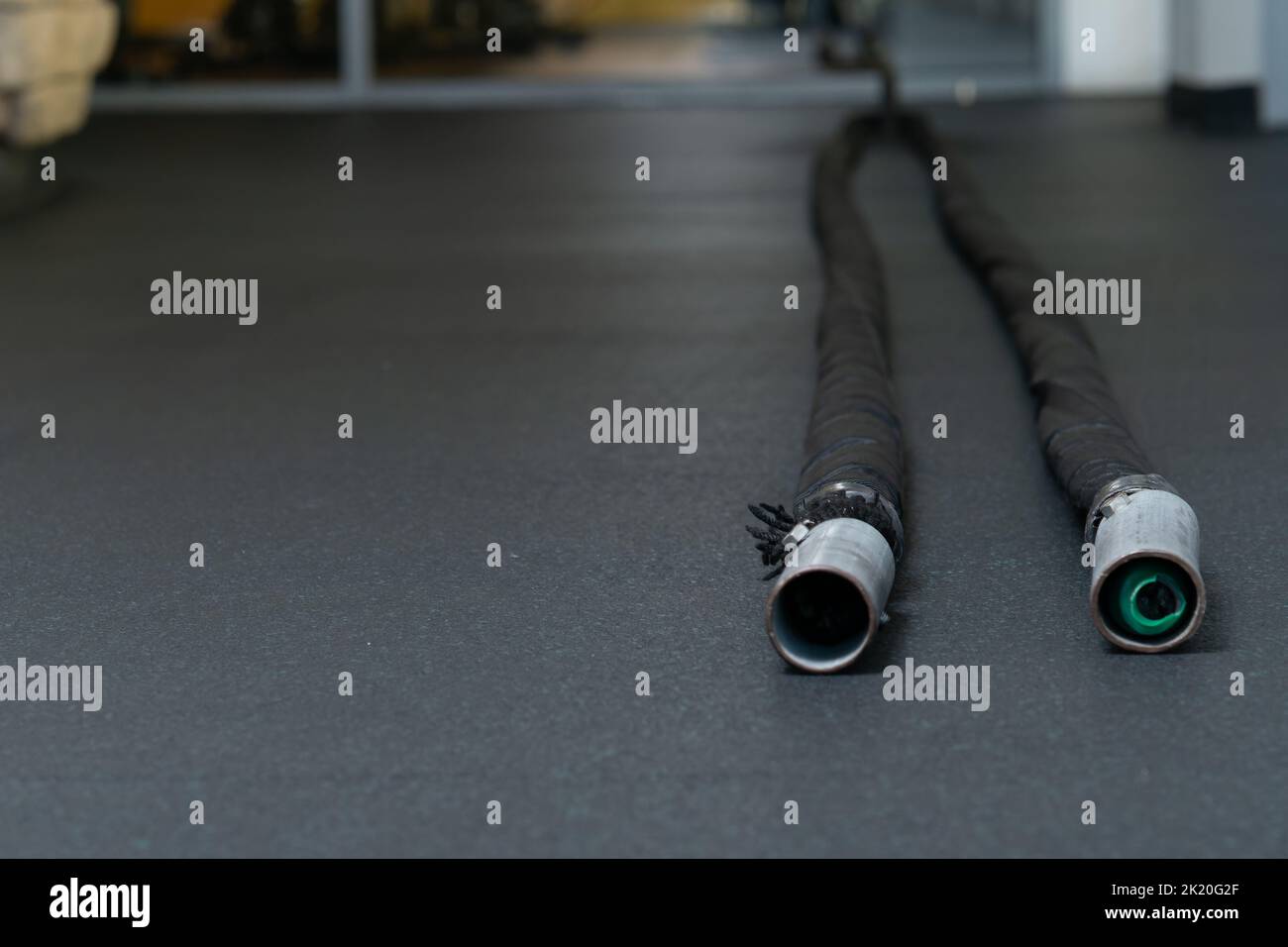 Gym fit training battle rope woman cross sport muscular, concept active ...