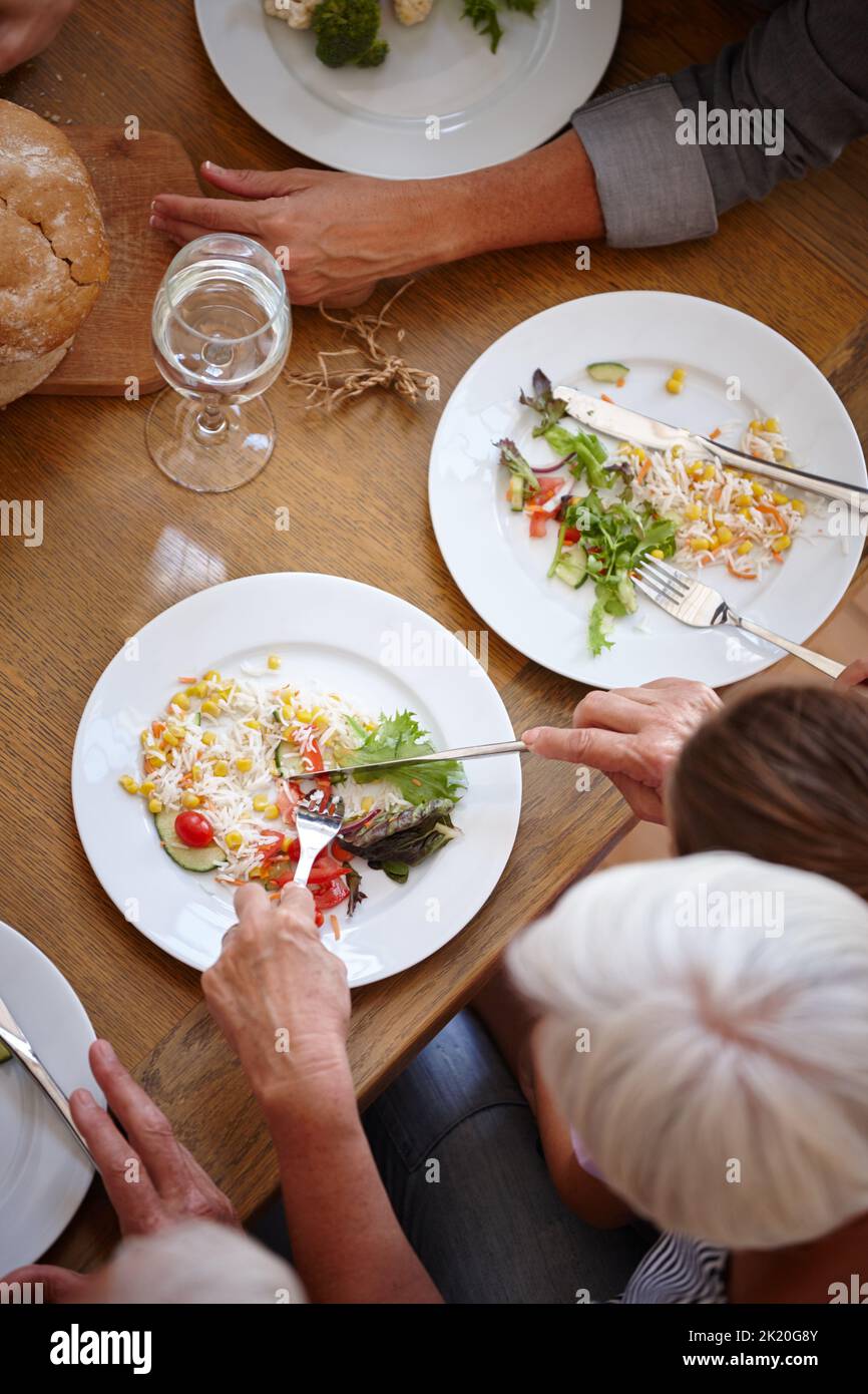 Good times with great food. High angle shot of a family sharing a meal ...