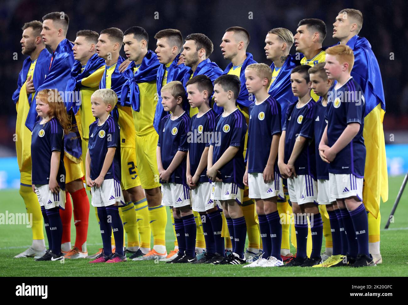 The Ukraine players line up wrapped in their national flag during the ...