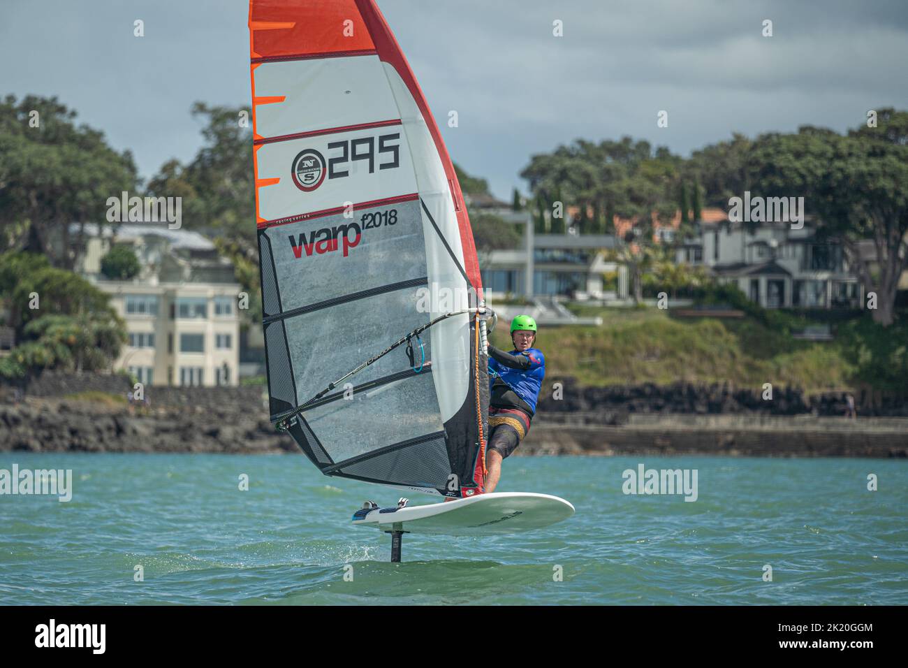 A man competes in a national windsurfing hydrofoil race at the ...