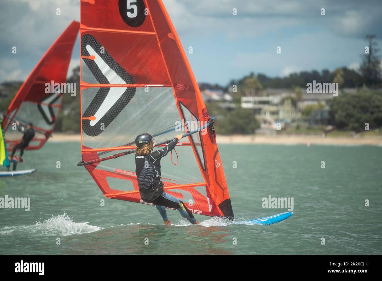 A man competes in a national windsurfing hydrofoil race at the ...