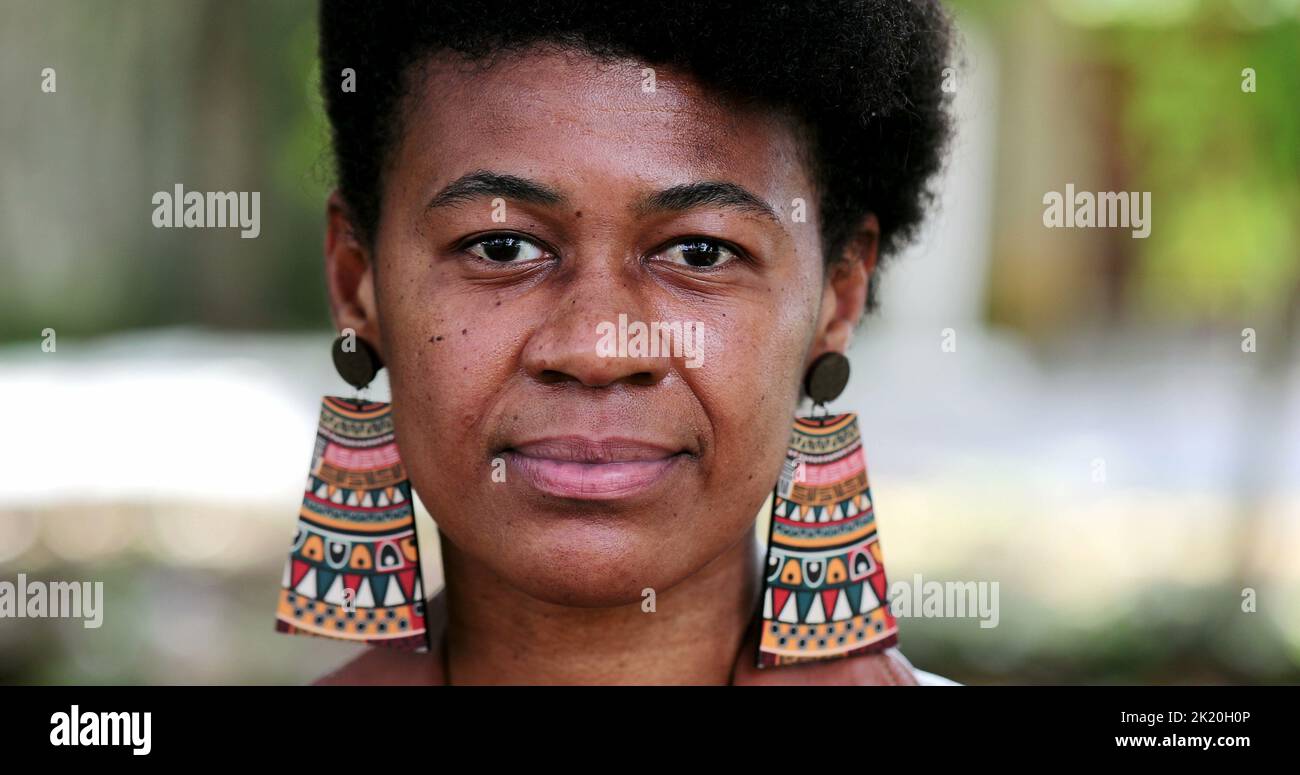 Black woman portrait face close-up staring at camera outside 40s Stock ...