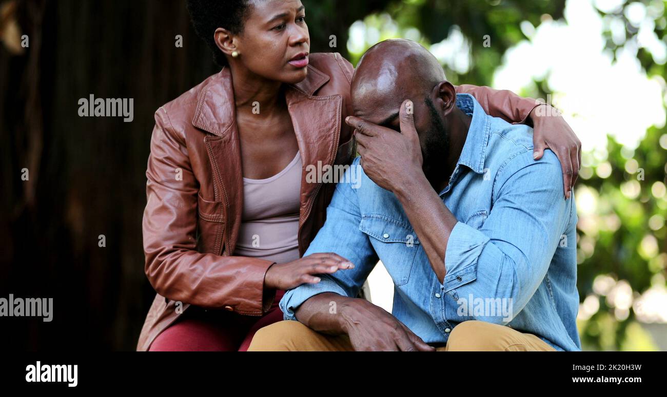Couple empathy, african woman consoling suffering depressed man Stock ...