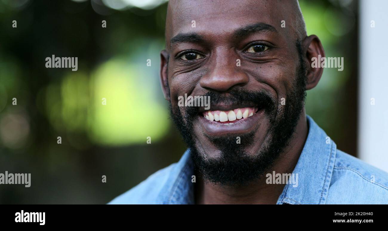 Confident black African man smiling portrait Stock Photo - Alamy