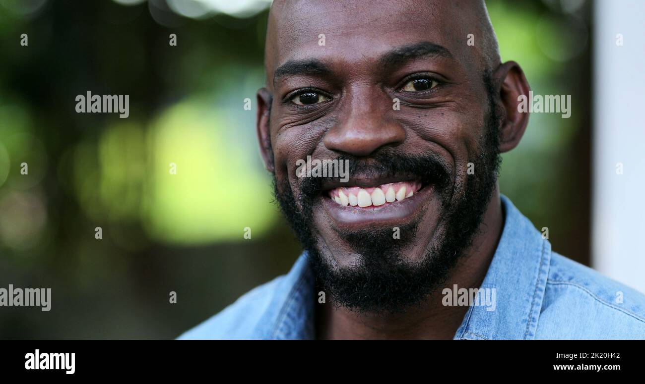 Confident black African man smiling portrait Stock Photo - Alamy