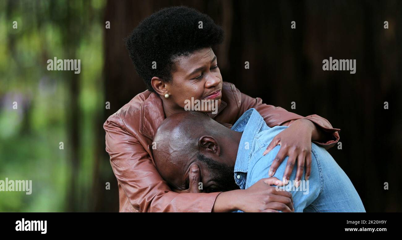 Black woman consoling crying depressed man Stock Photo - Alamy