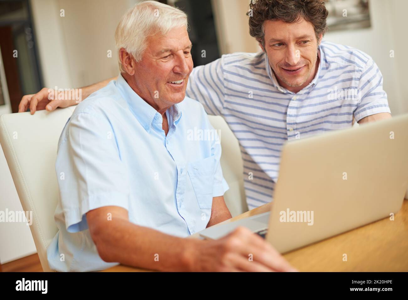 old man with laptop computer showing thumbs up Stock Photo - Alamy