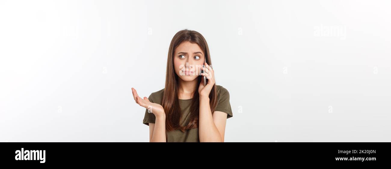 Worried young woman looks nervously, Female is nervous while talking on ...