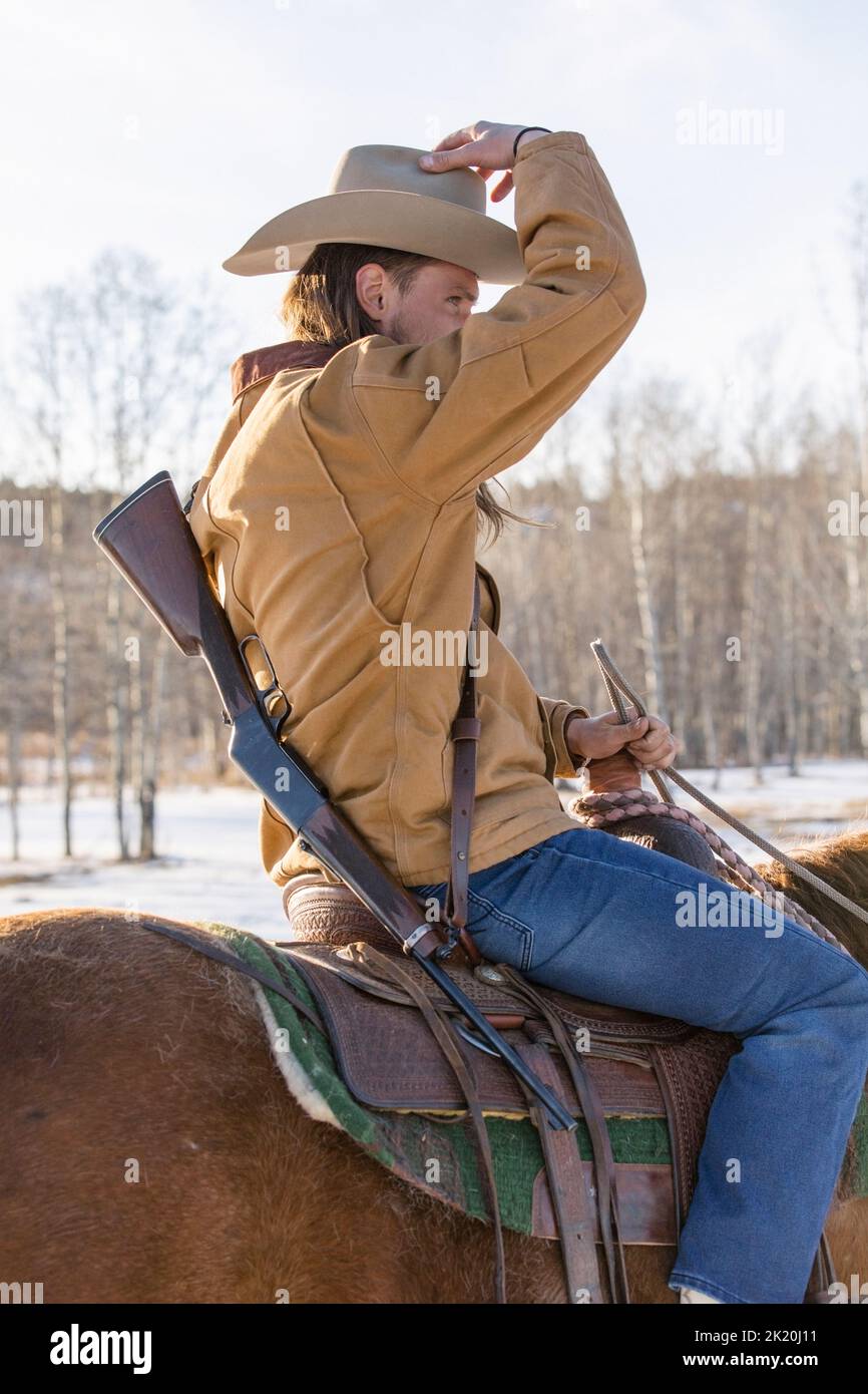 Cowboy with rifle hi-res stock photography and images - Alamy