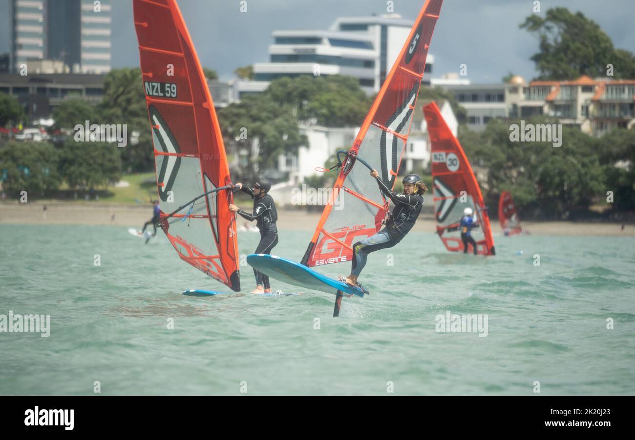 Competitors race in a national windsurfing hydrofoil race at the ...