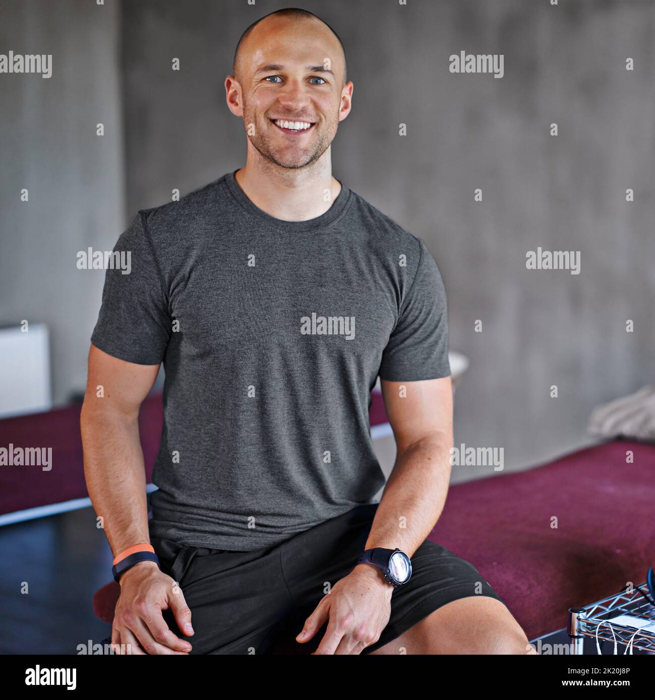 Leading my clients to a healthier life. a trainer sitting by equipment ...