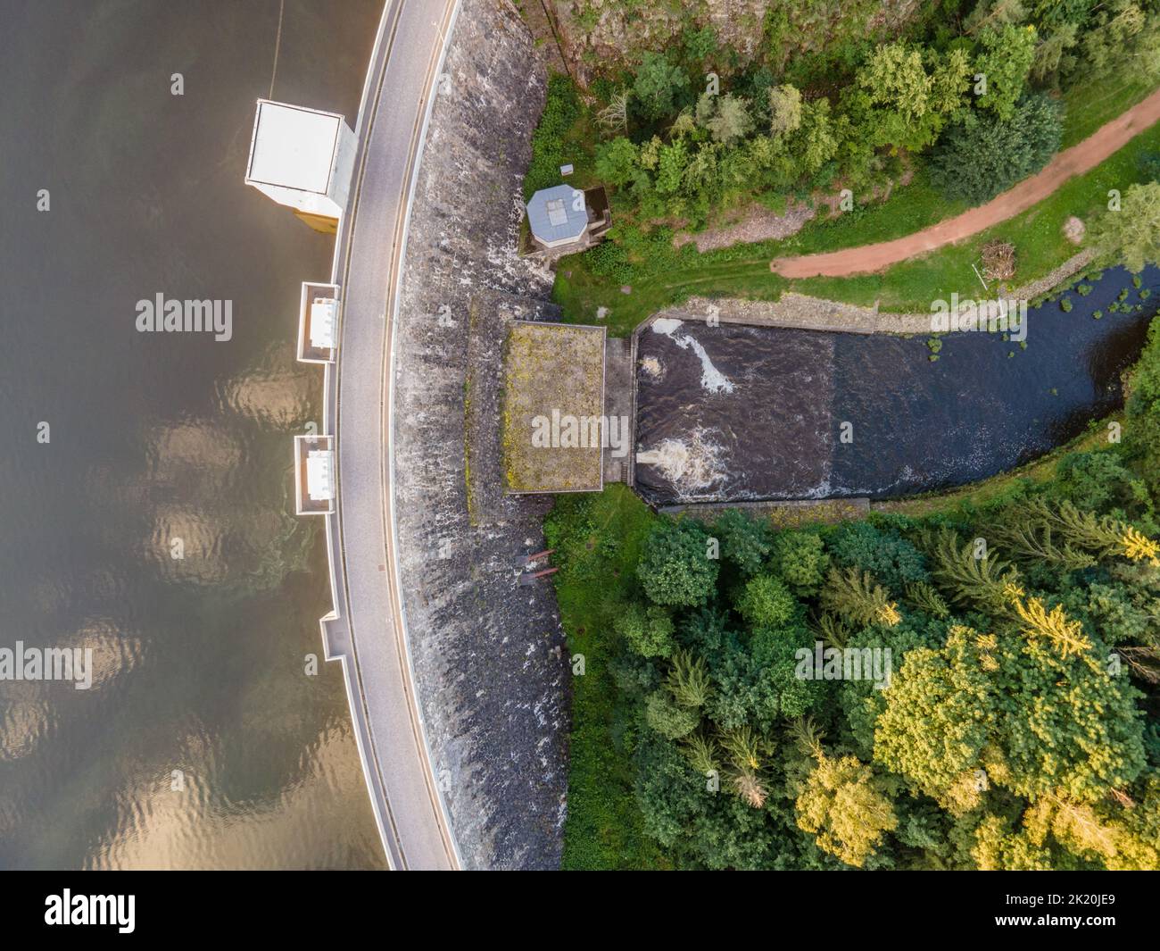 An aerial view of a lake dam near a forest Stock Photo - Alamy