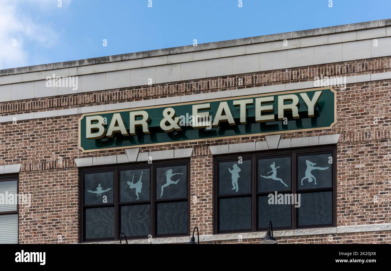 A bar and eatery sign on the building Stock Photo - Alamy