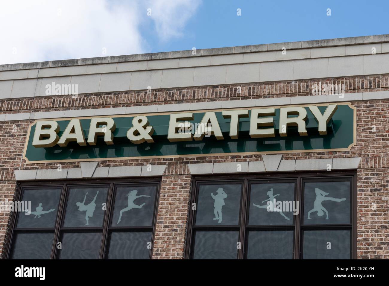 A bar and eatery sign on the building Stock Photo - Alamy