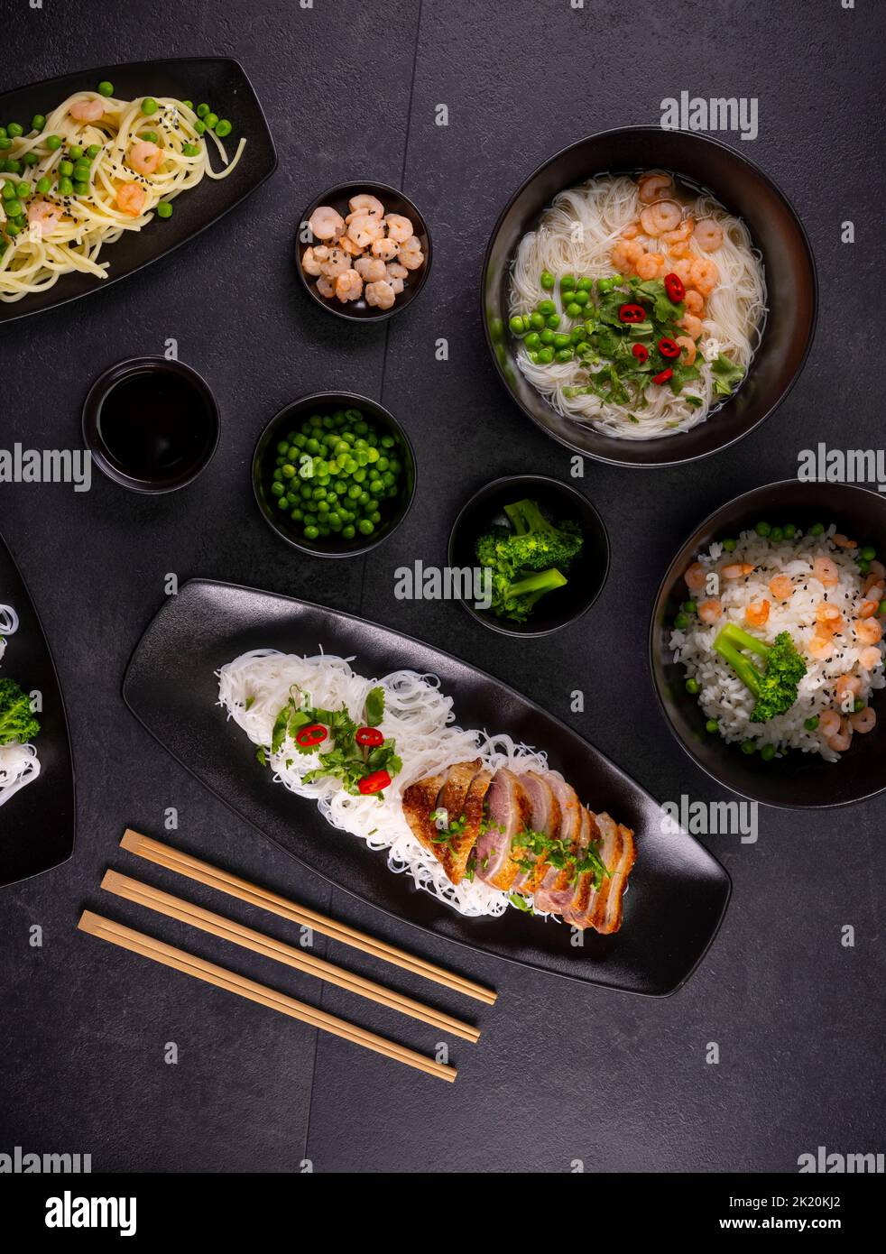 Various dishes of Asian cuisine with different types noodles and rice ...