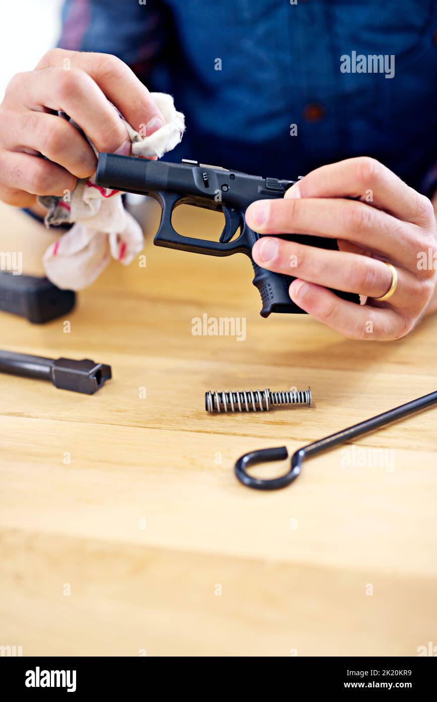 Regular maintenance is essential for every gun owner. Cropped view of a ...