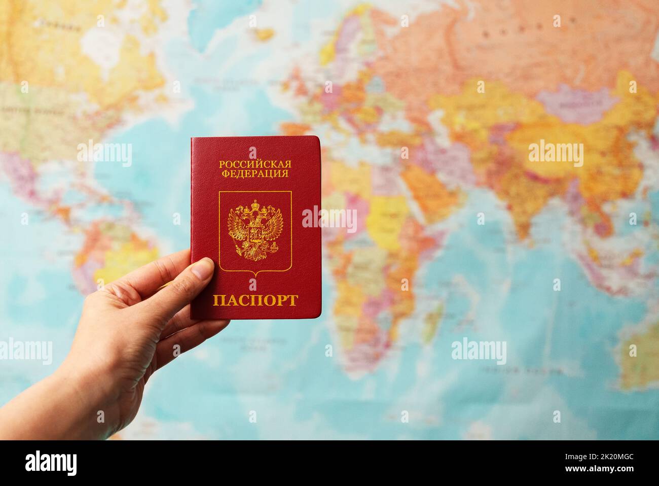 Russian federation passport in front of world map Stock Photo - Alamy