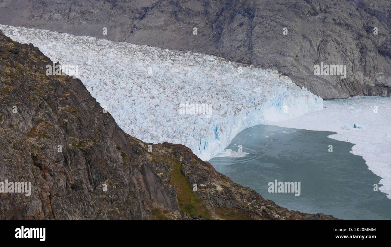 Calving iceberg from a mountain near Narsarsuaq Stock Photo - Alamy