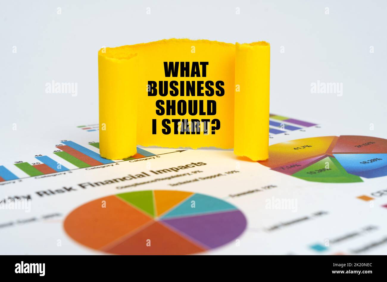 Business concept. Against the background of graphs and charts, a yellow ...