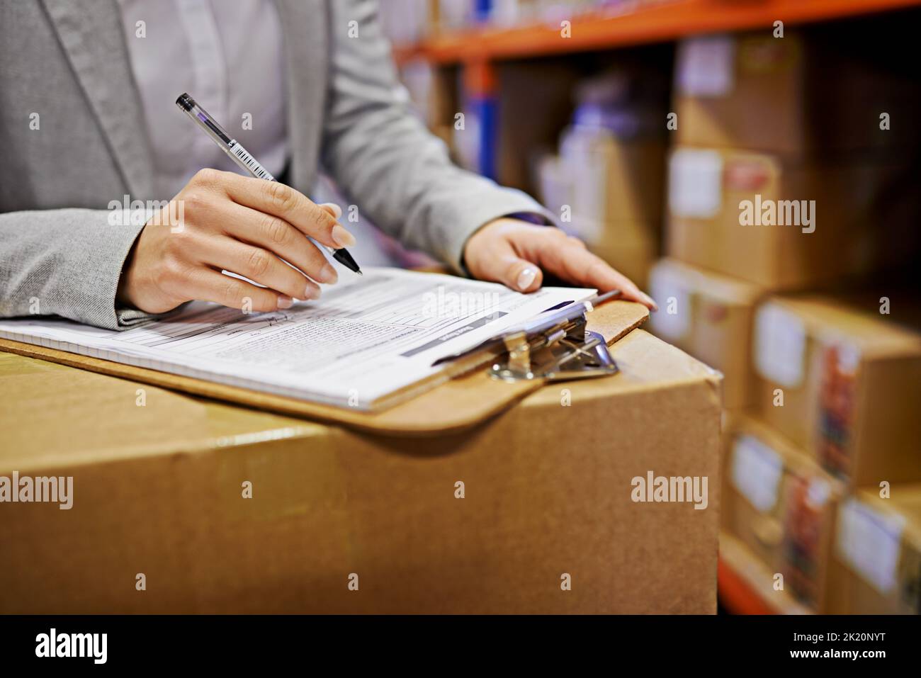 Your shipping paperwork is in order. a woman at work in a storage ...