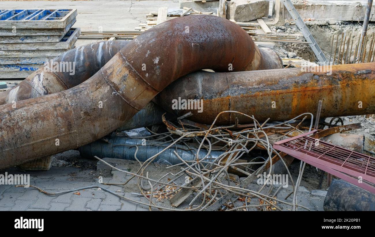 Old rusty metal pipes. Construction work to replace heating pipes ...