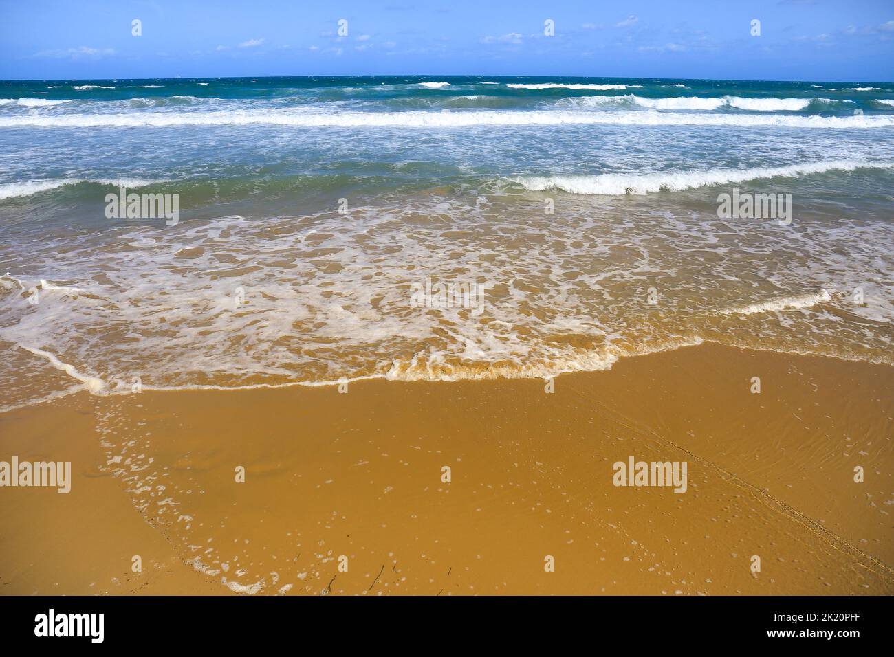 Waves drawing geometric shapes on the shore on the beach in Spain Stock ...