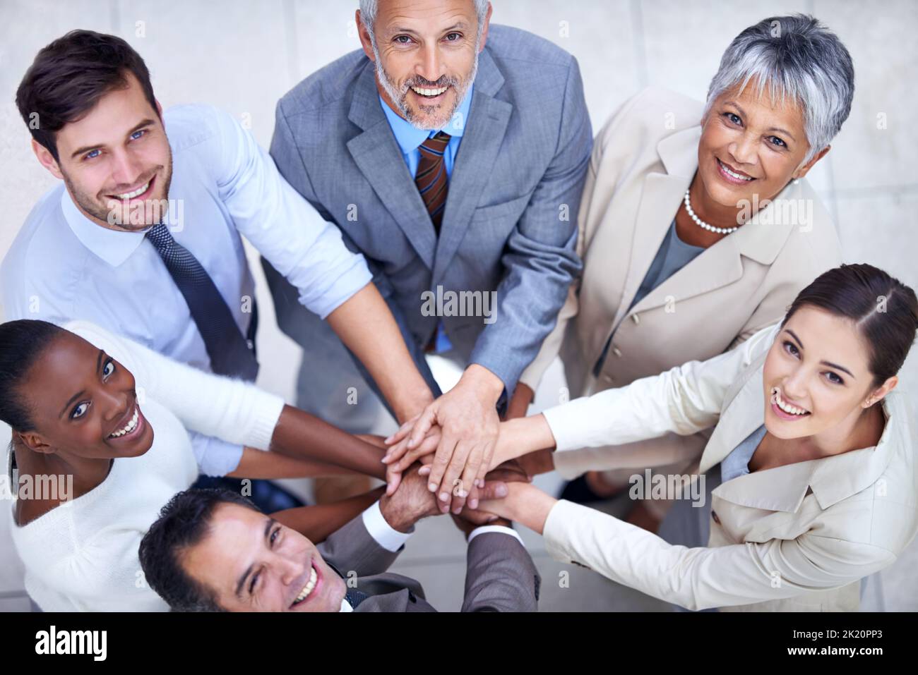 Business diversity and success. a group of coworkers with their hands in a huddle Stock Photo ...