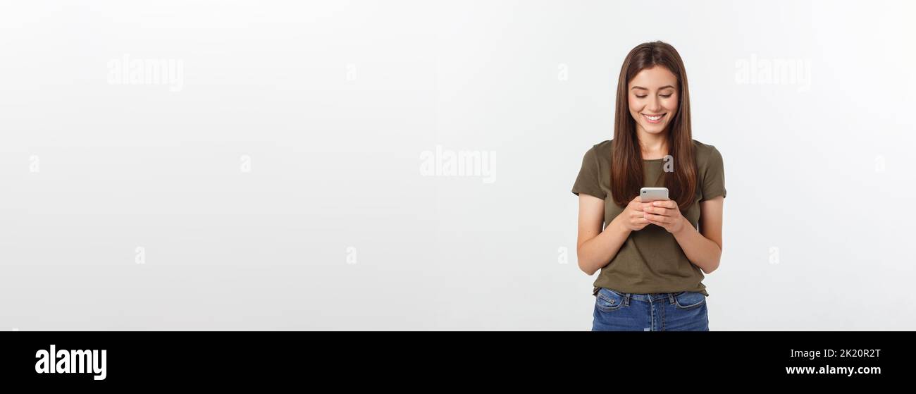 Laughing woman talking and texting on the phone isolated on a white ...