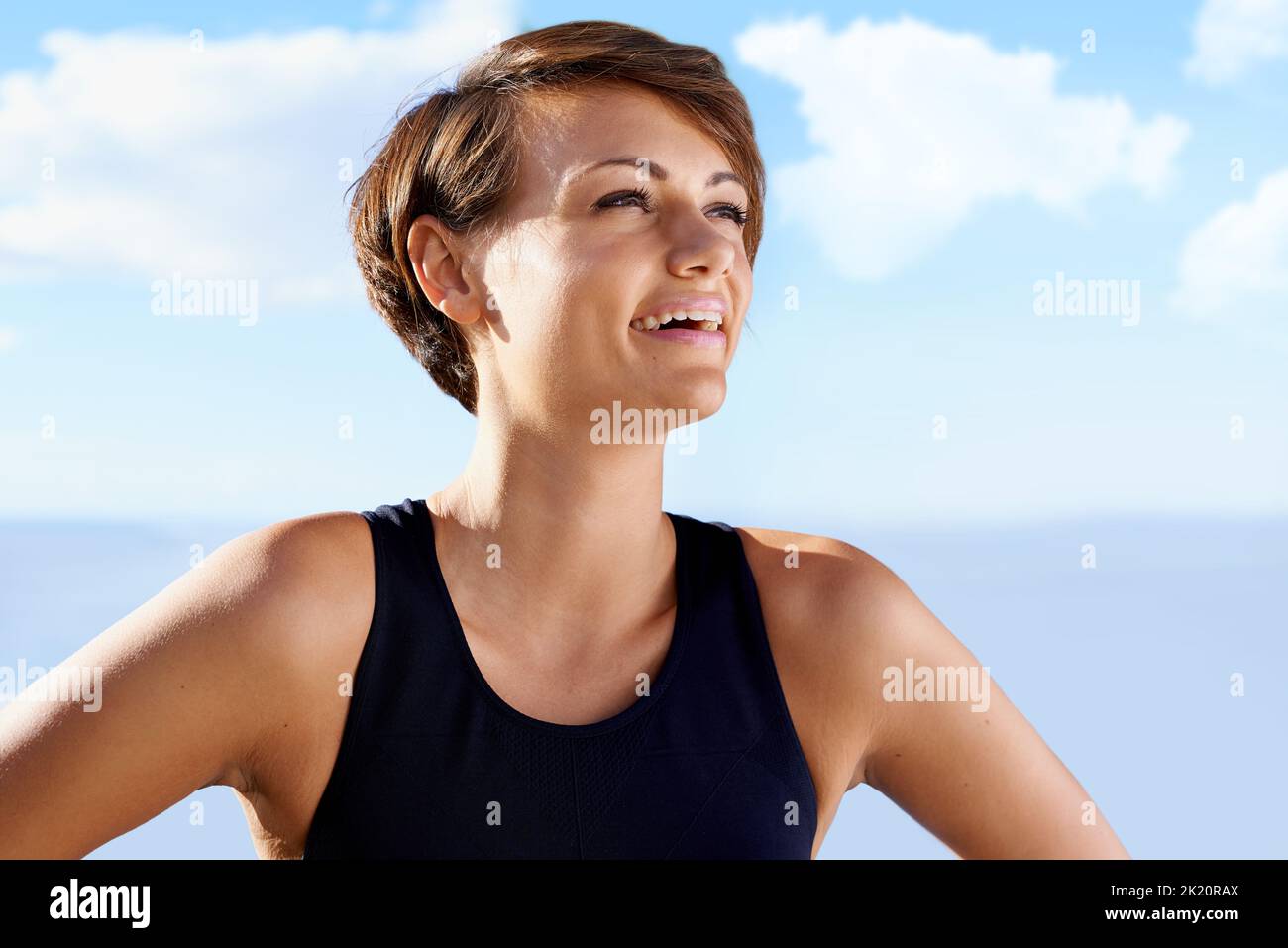 The best part of my day. A beautiful young runner standing outdoors on ...