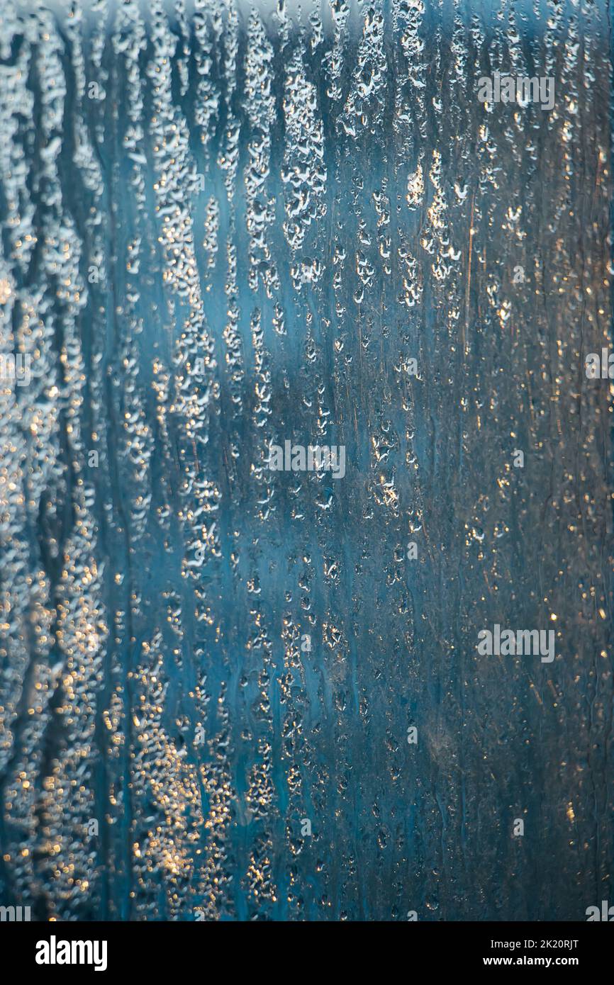 Texture of misted glass in autumn. Drops of water on window in rainy ...