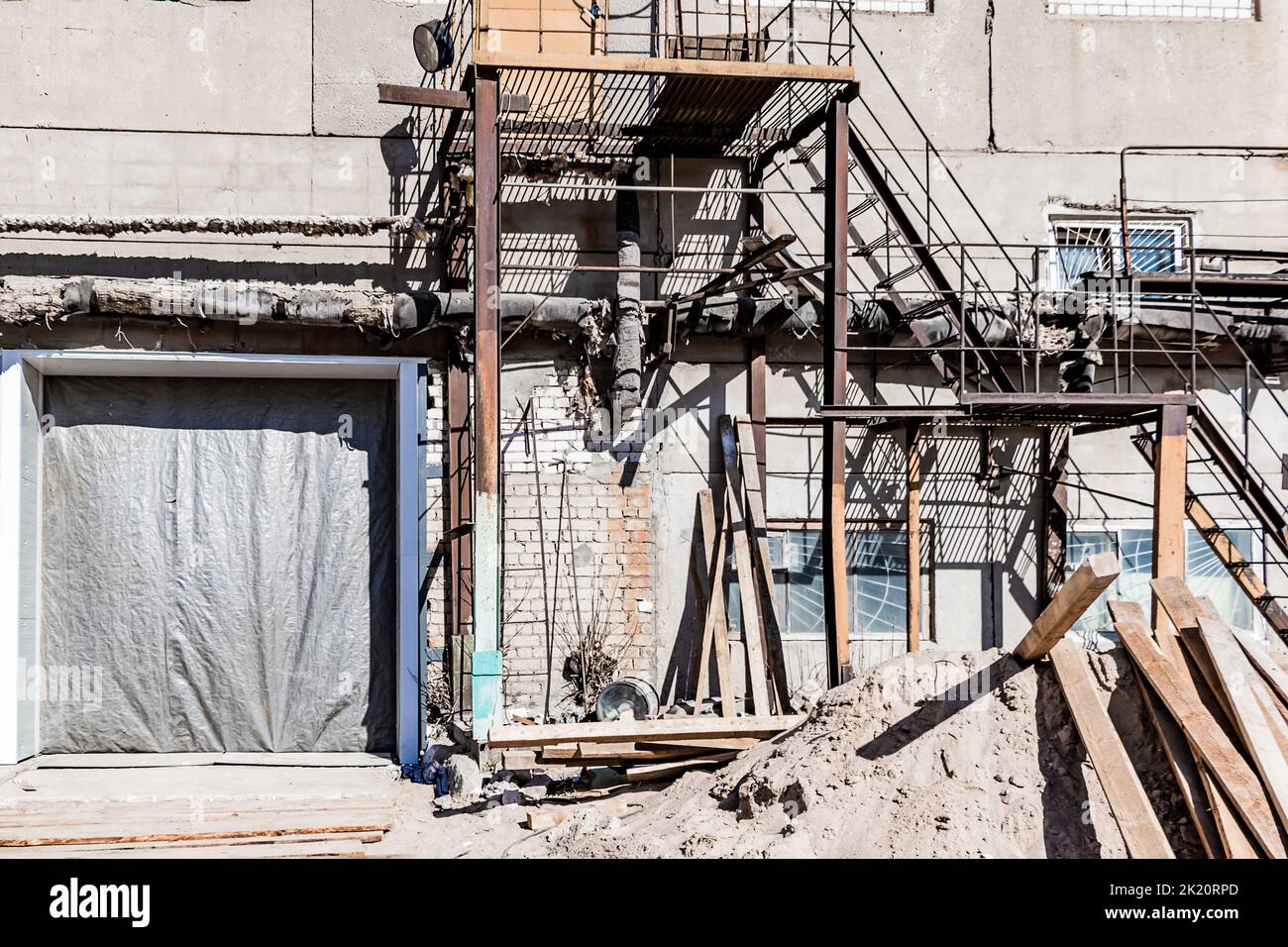 Old destroyed construction site. Rusty scaffolding and construction ...