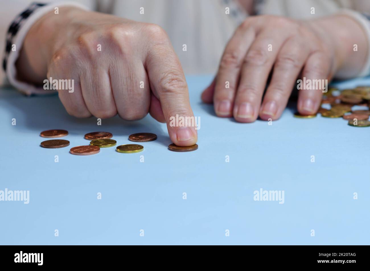 Poor woman counting money hi-res stock photography and images - Alamy