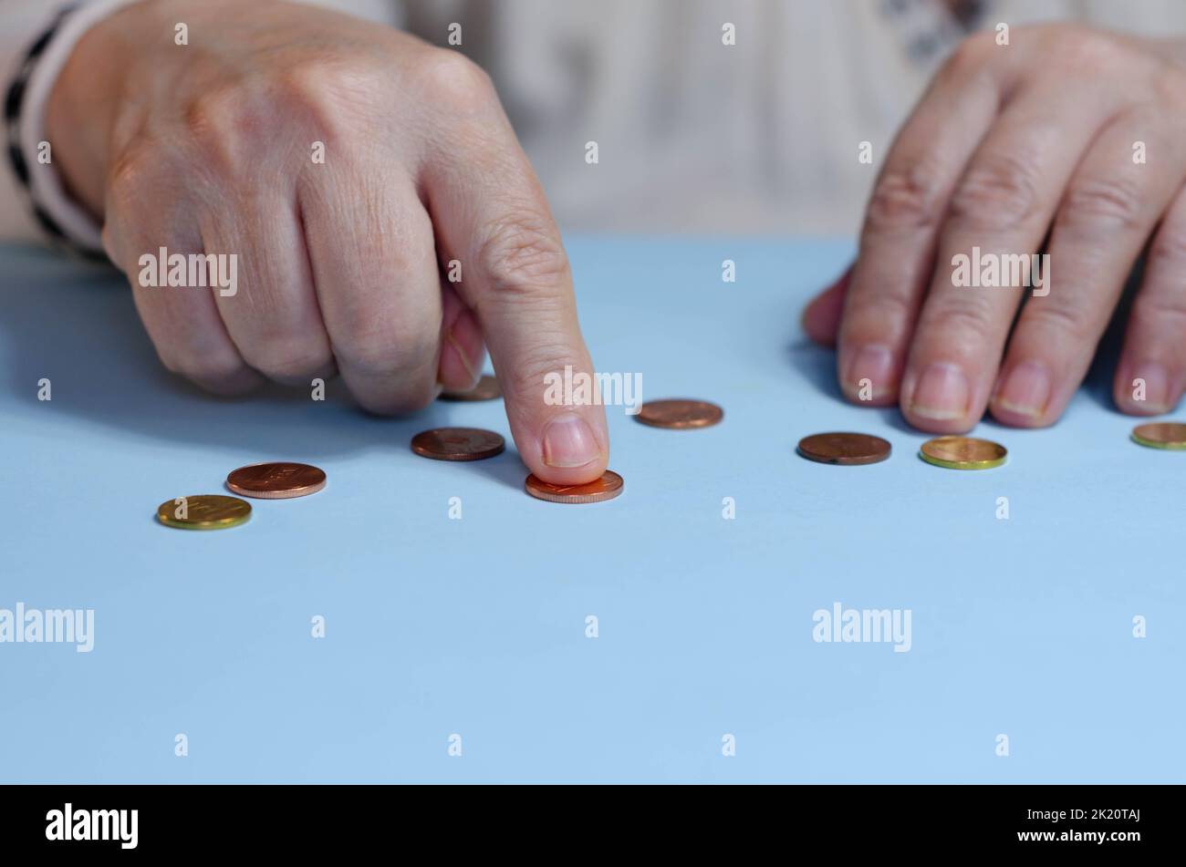 Old person counting coins hi-res stock photography and images - Alamy