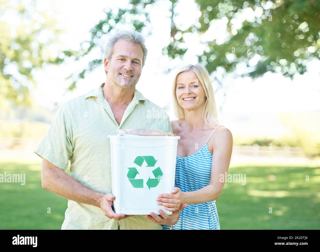 Were passionate about conservation. A happy couple standing in a park ...