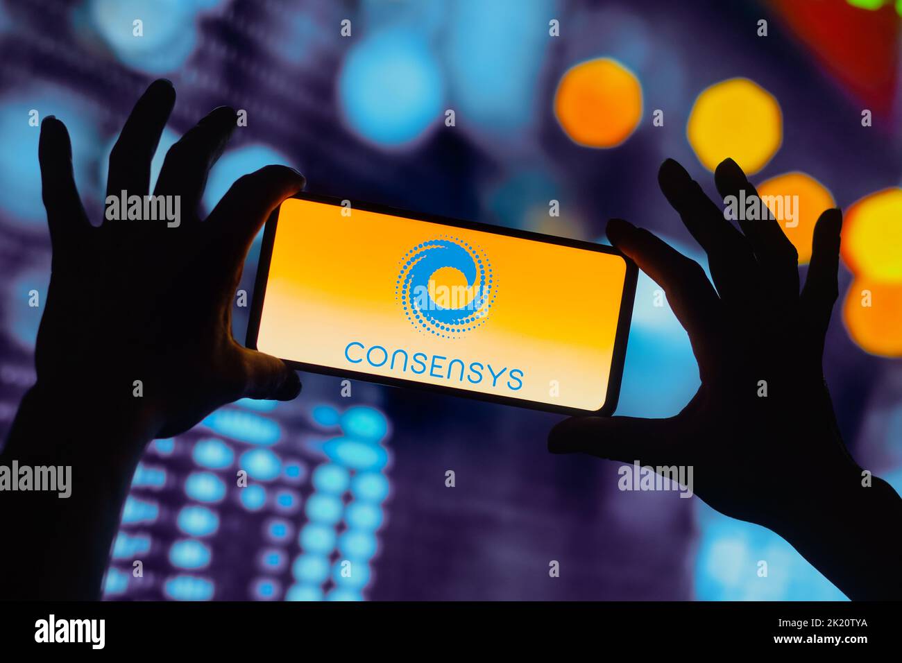 In this photo illustration, the ConsenSys logo seen displayed on a ...