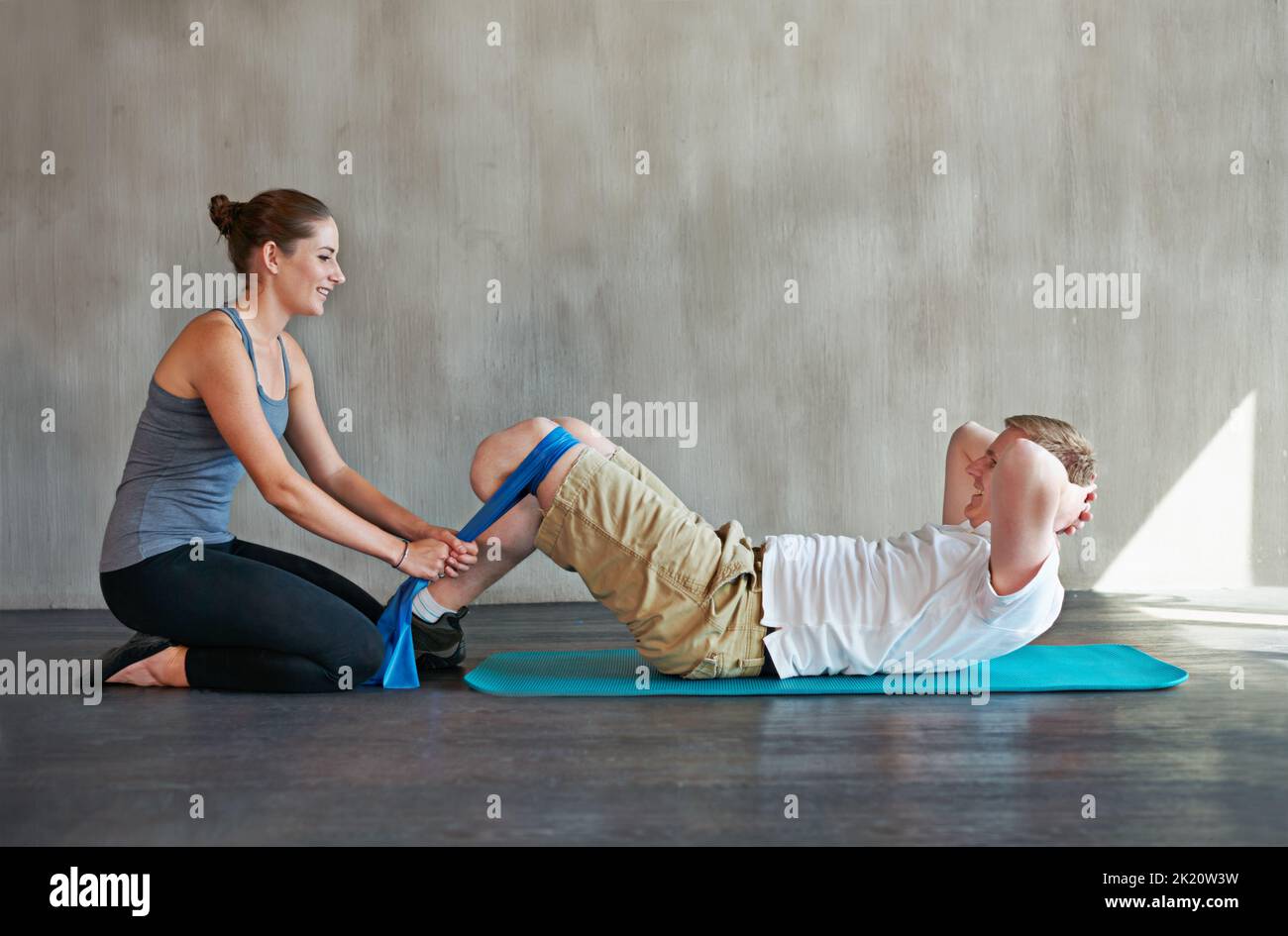 Getting stronger every day. Studio shot of a young amputee training in ...