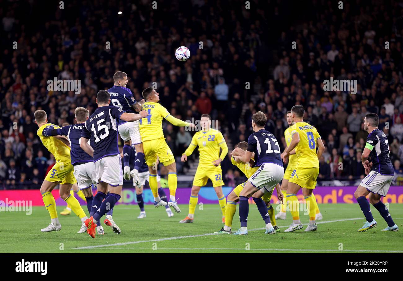 Scotland's Lyndon Dykes scores their side's third goal of the game ...