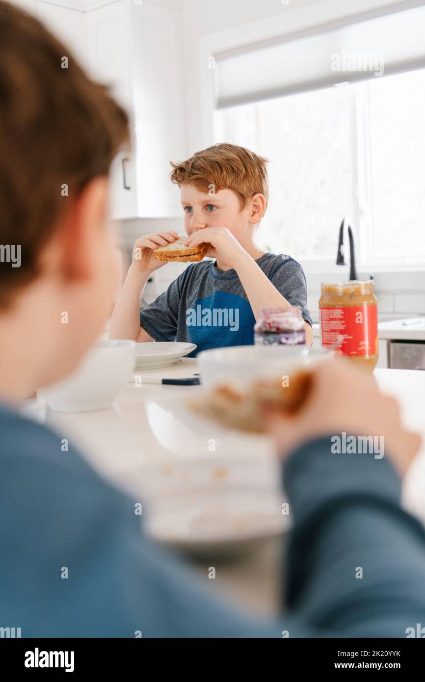 Child eating peanut butter sandwich hi-res stock photography and images ...