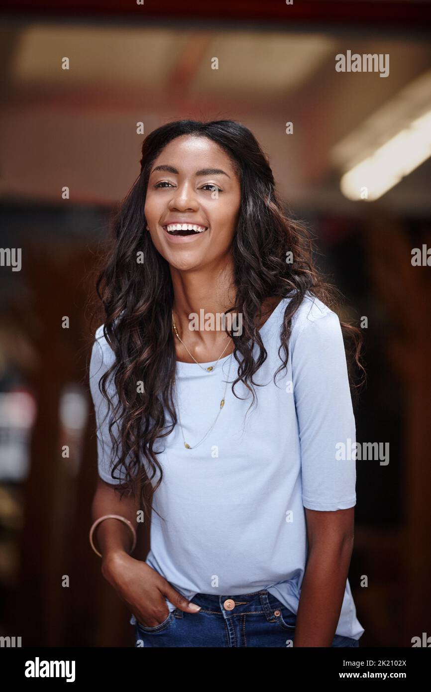 Happy girls are the prettiest. a beautiful woman posing indoors Stock ...