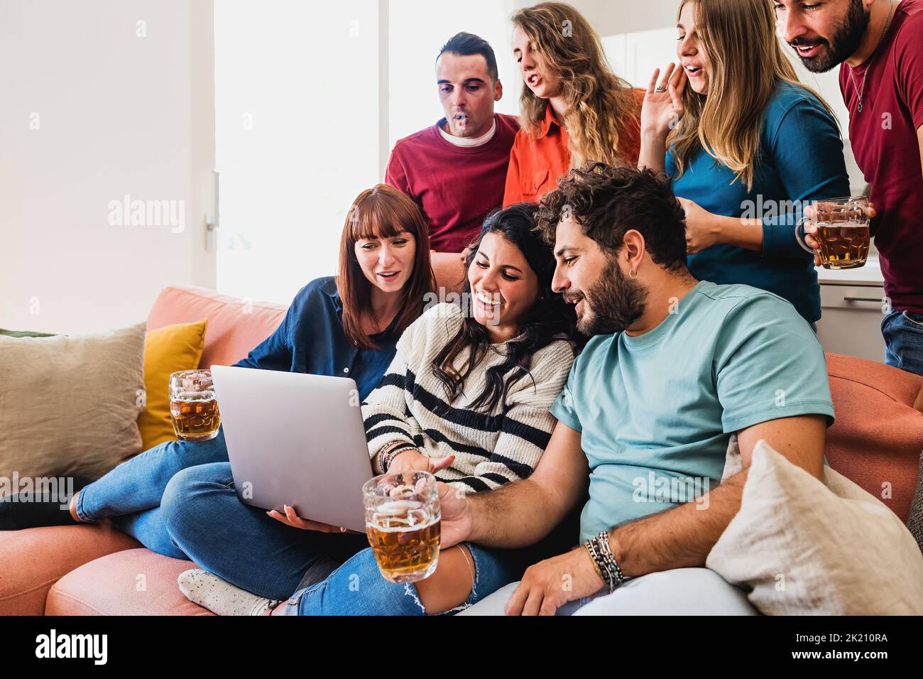 Group of happy young friends having fun watching internet social ...